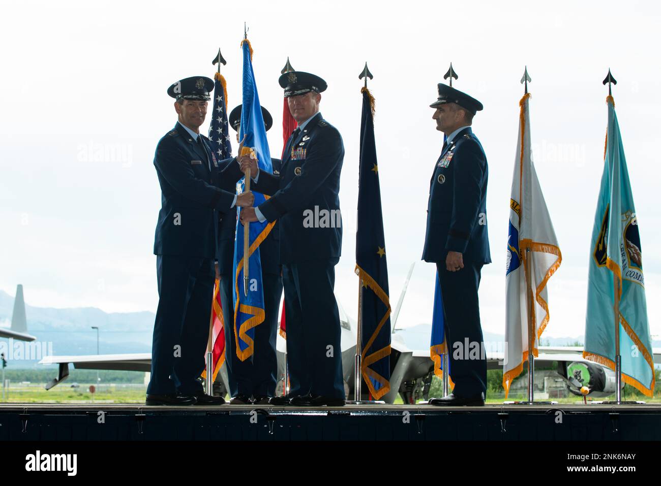 U.S. Air Force Lt. Gen. David A. Krumm, center, passes the 11th Air ...