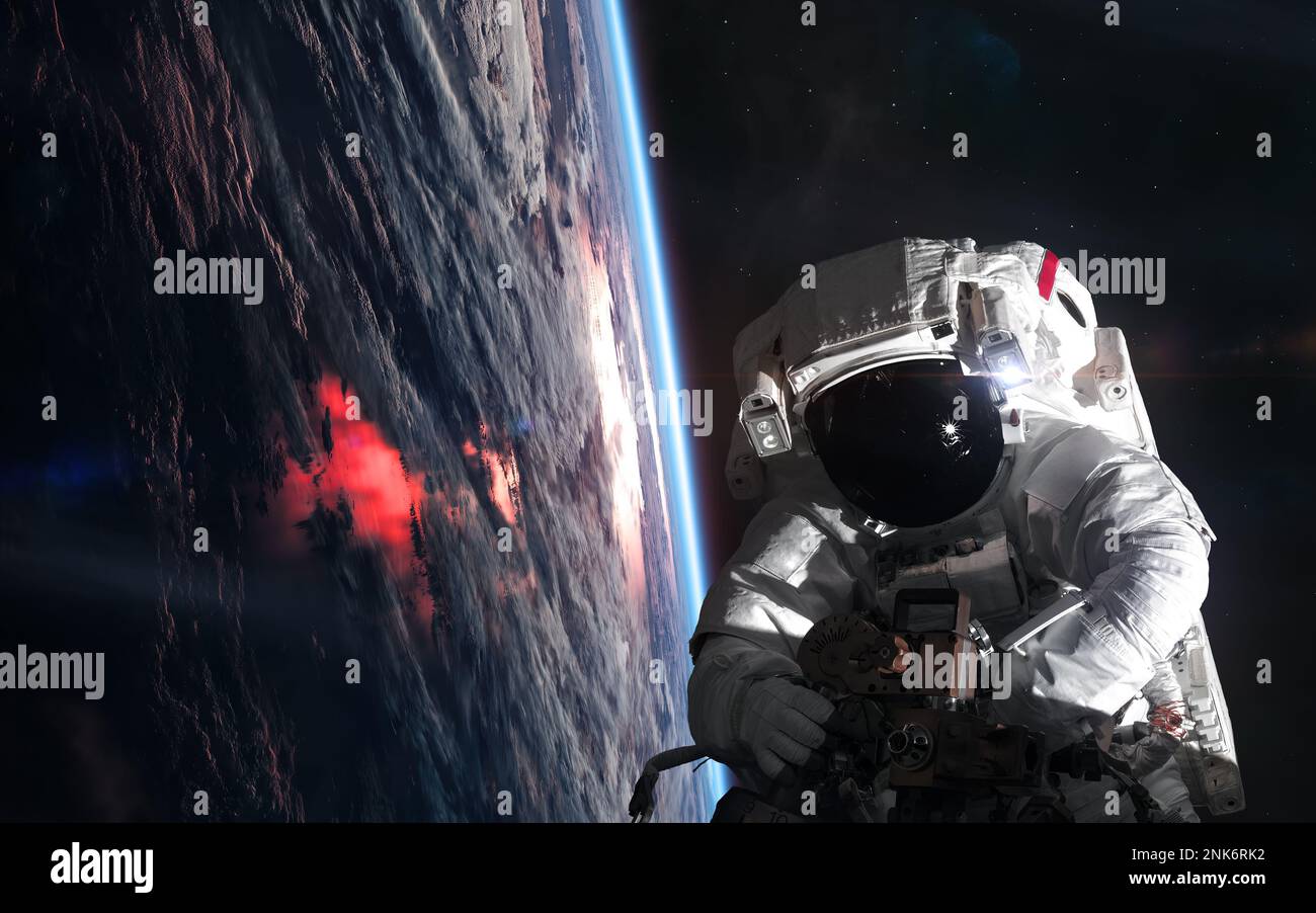 Astronaut in outer space orbiting planet Earth. Solar system Stock ...