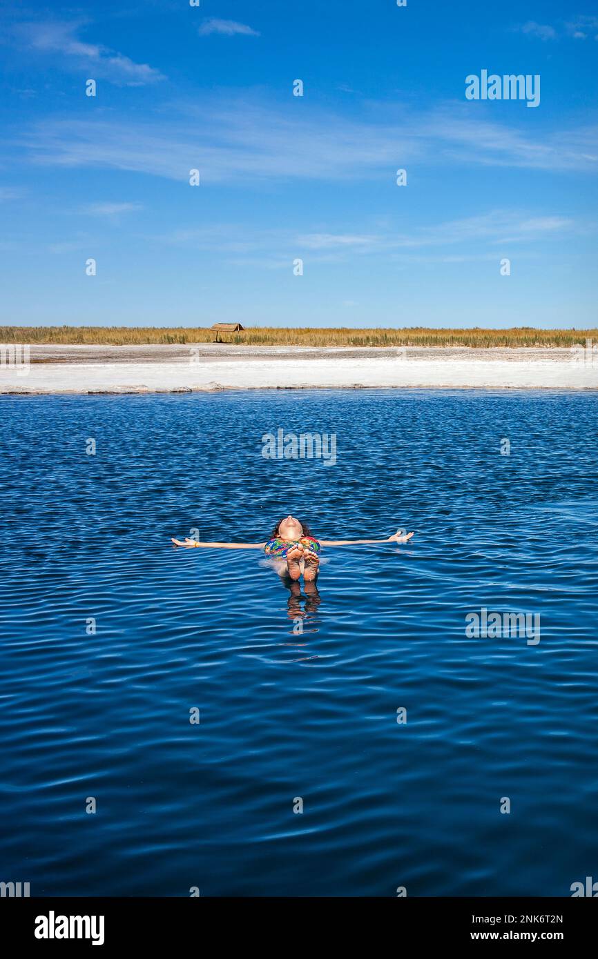 Floating in Laguna Cejar or Sejas, Salar de Atacama, Atacama Desert ...