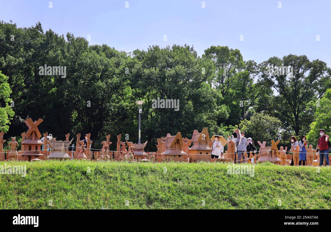 Around 190 haniwa (clay figures) of houses, people and animals line up ...