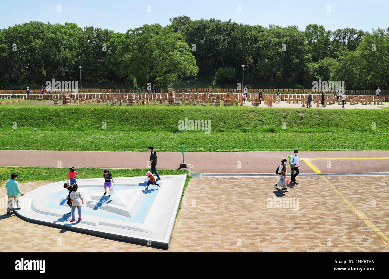 Around 190 haniwa (clay figures) of houses, people and animals line up ...