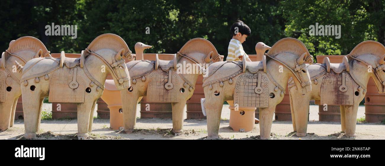 Around 190 haniwa (clay figures) of houses, people and animals line up ...