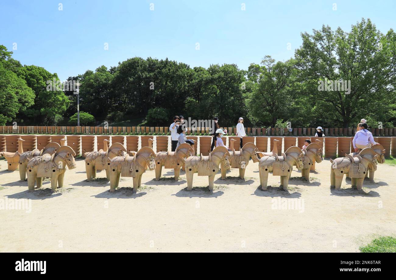 Around 190 haniwa (clay figures) of houses, people and animals line up ...