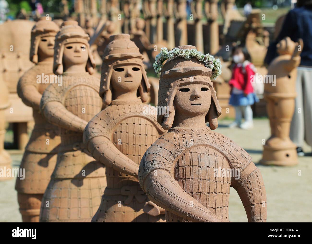 Around 190 haniwa (clay figures) of houses, people and animals line up ...