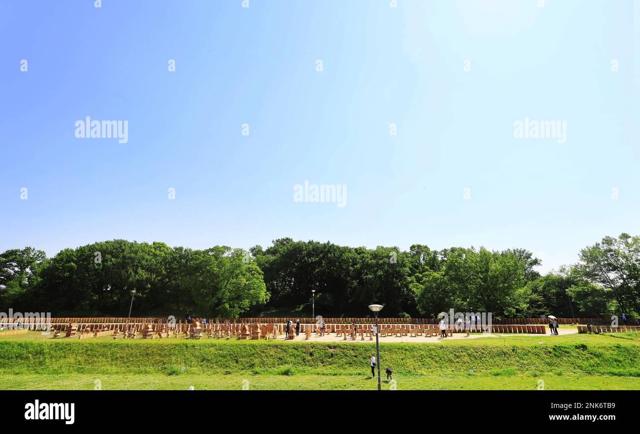 Around 190 haniwa (clay figures) of houses, people and animals line up ...