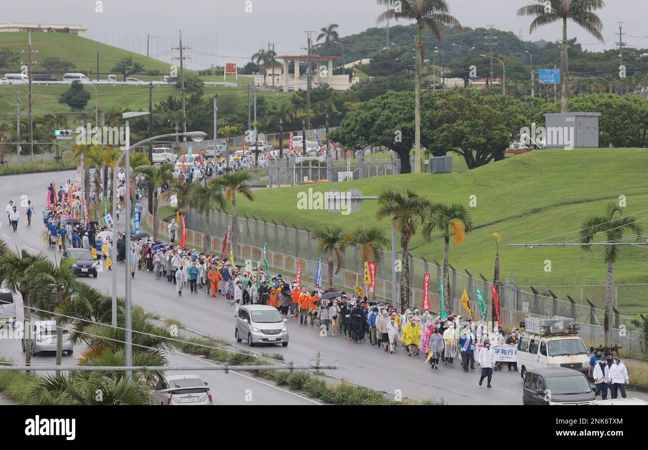 Participants march near U.S. military's Camp Foster, also known as Camp ...