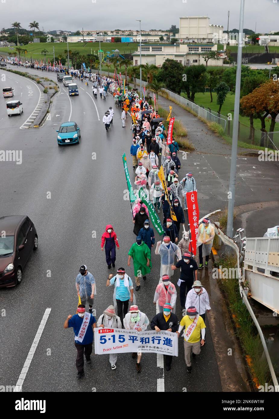 Participants march near U.S. military's Camp Foster, also known as Camp ...