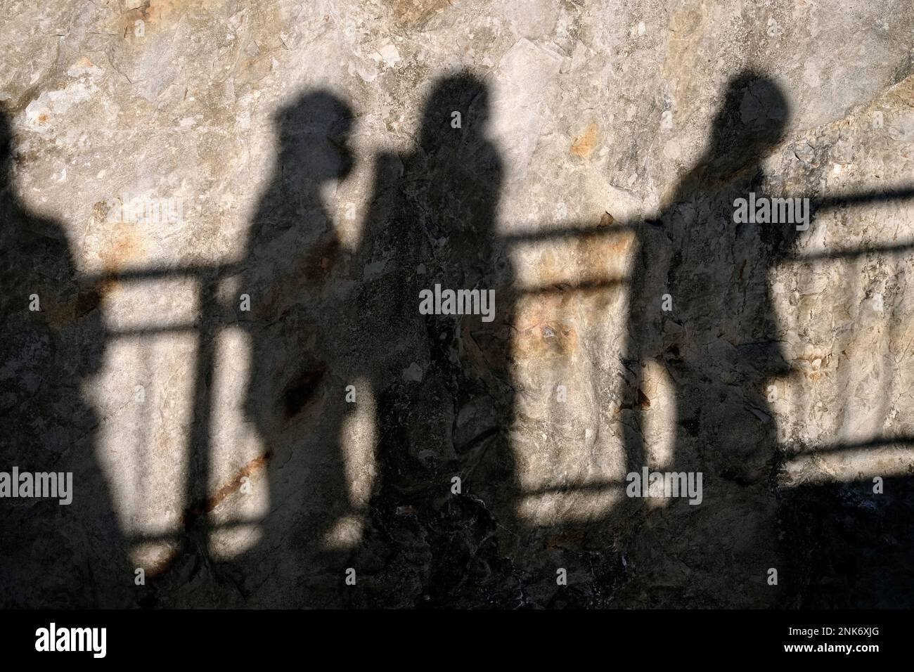 Shadow of a crowd of people on a cliff Stock Photo - Alamy