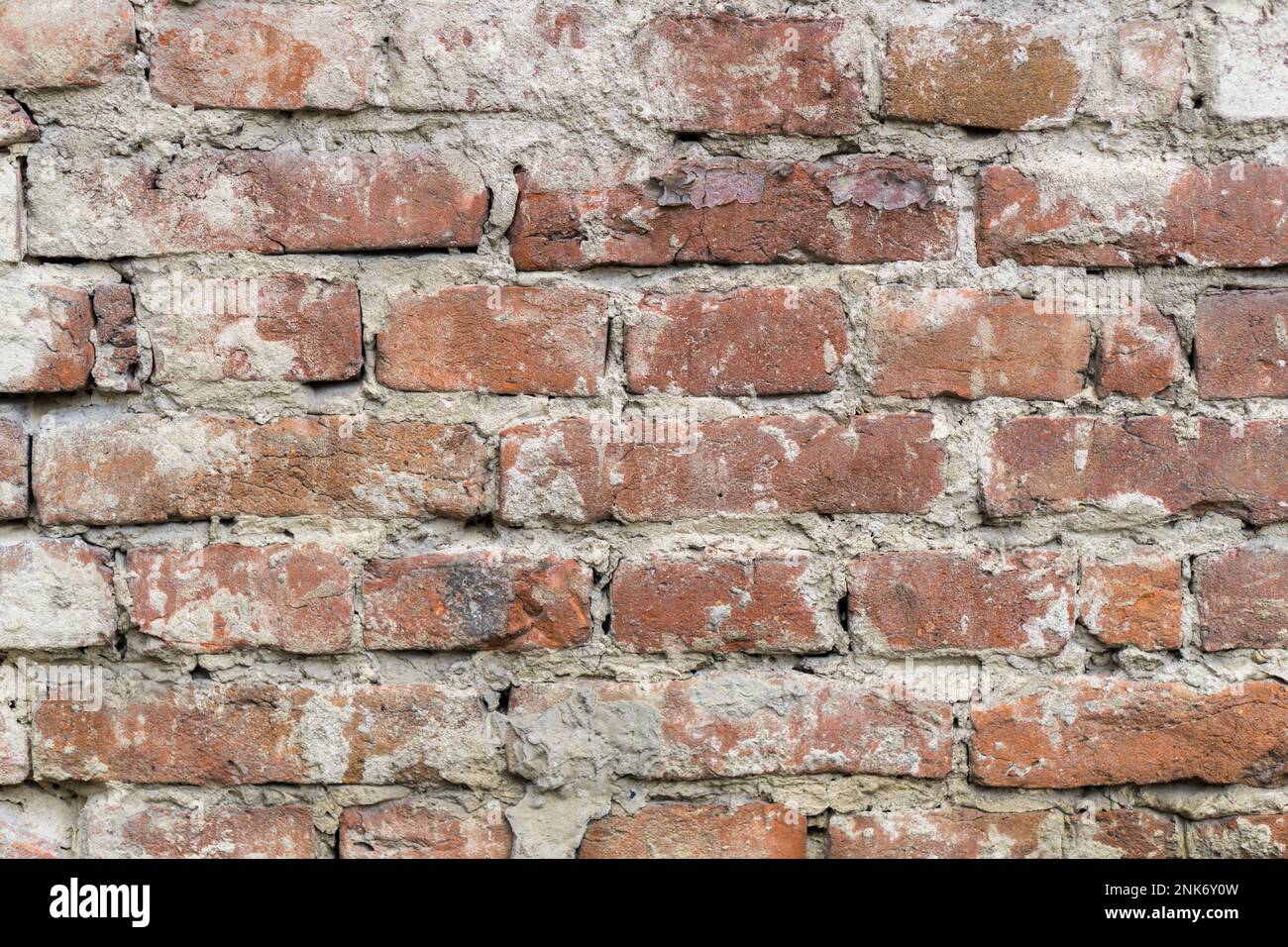 Red uneven brick wall backgroundold. Closeup horizontal Stock Photo - Alamy