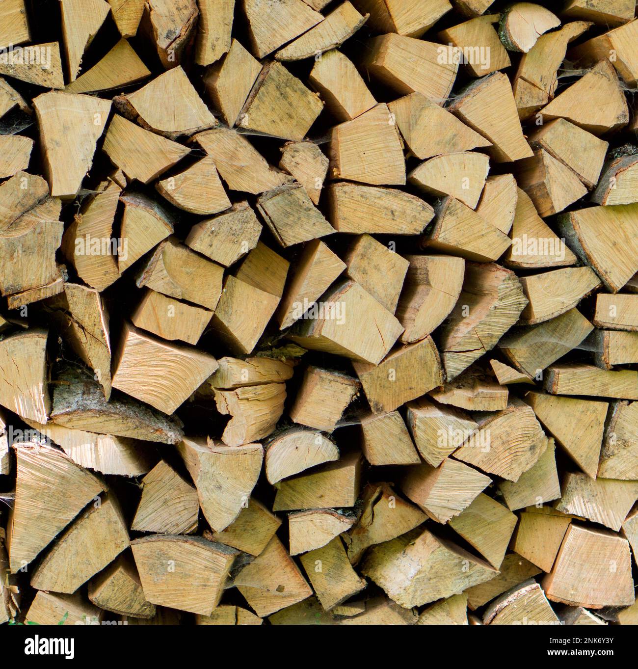 Pile of chopped fire wood logs prepared for winter. Close up, square ...