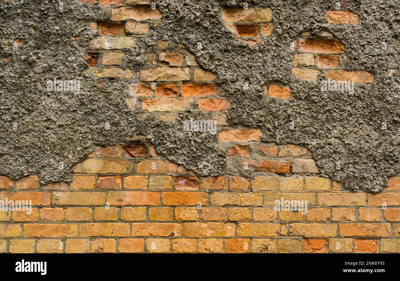 Red old uneven brick wall and cement background. Horizontal. Copy space ...