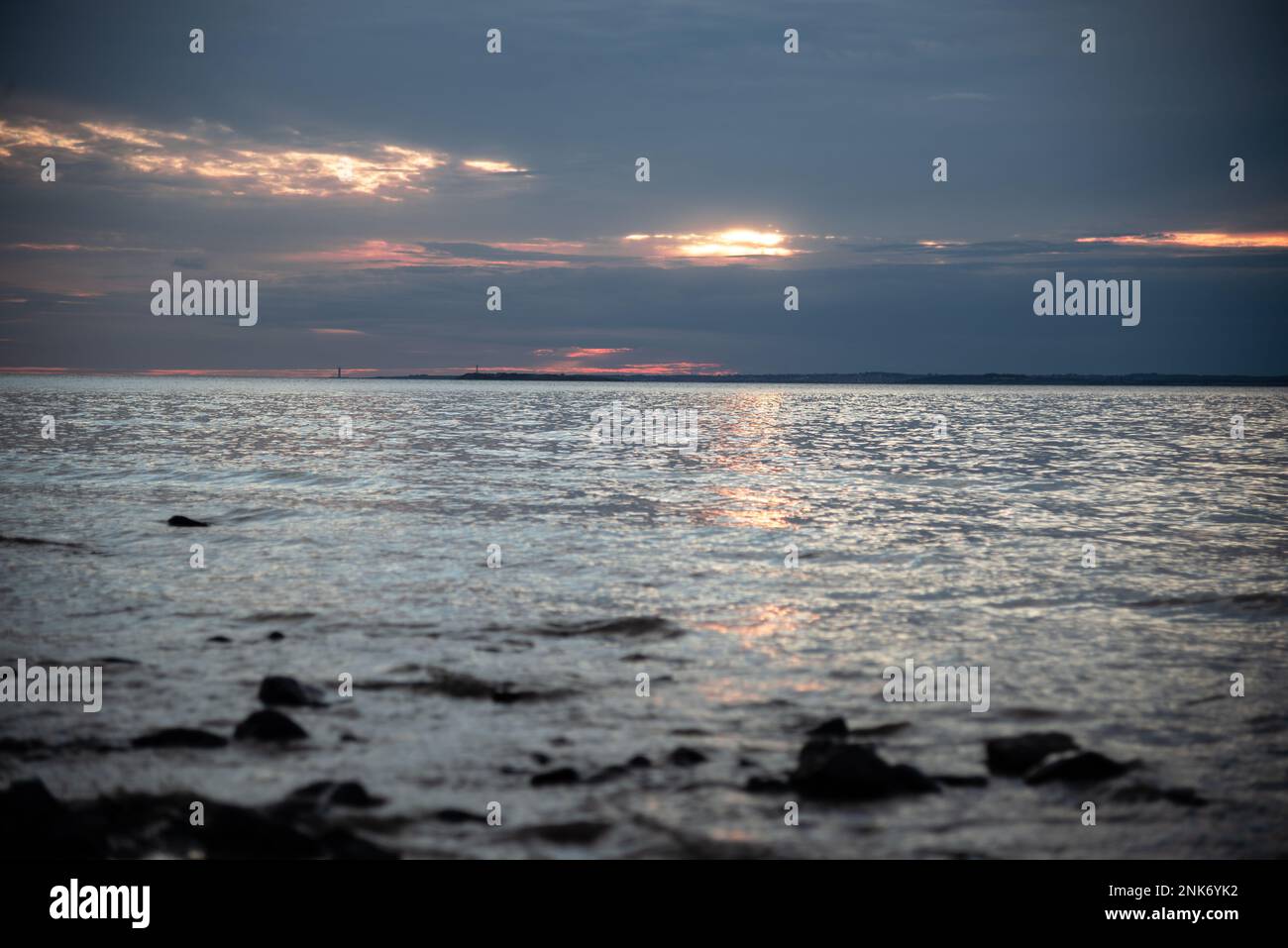 View sunset on sea side in England Stock Photo - Alamy