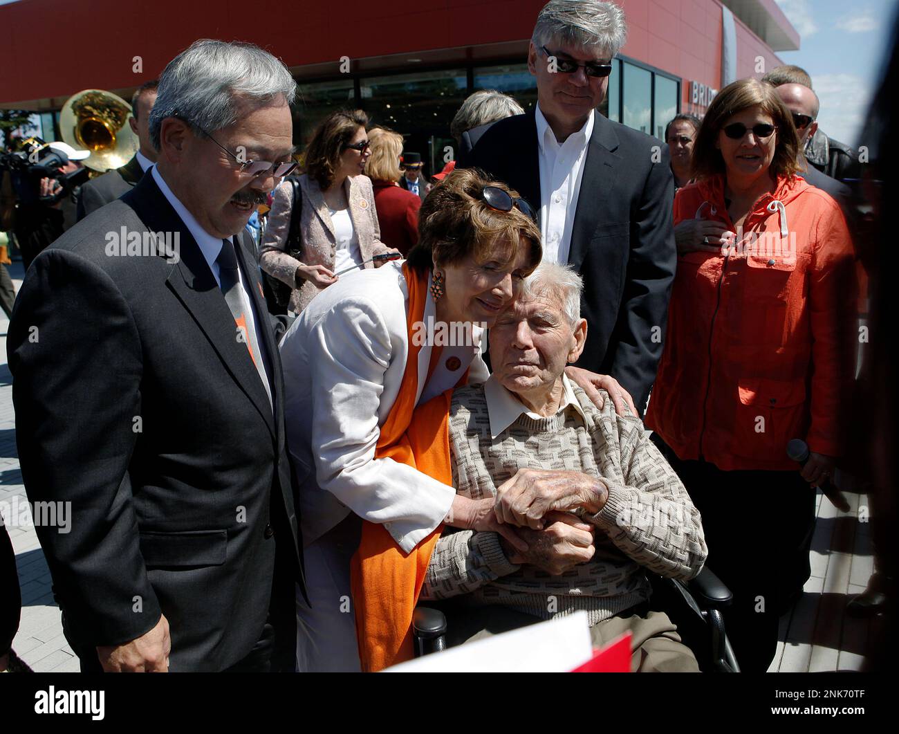Rep. Nancy Pelosi hugs Gus Villalta, an ironworker who helped build the ...