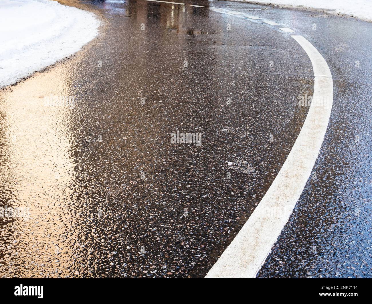 slippery from frozen melted snow surface of urban asphalt road Stock ...