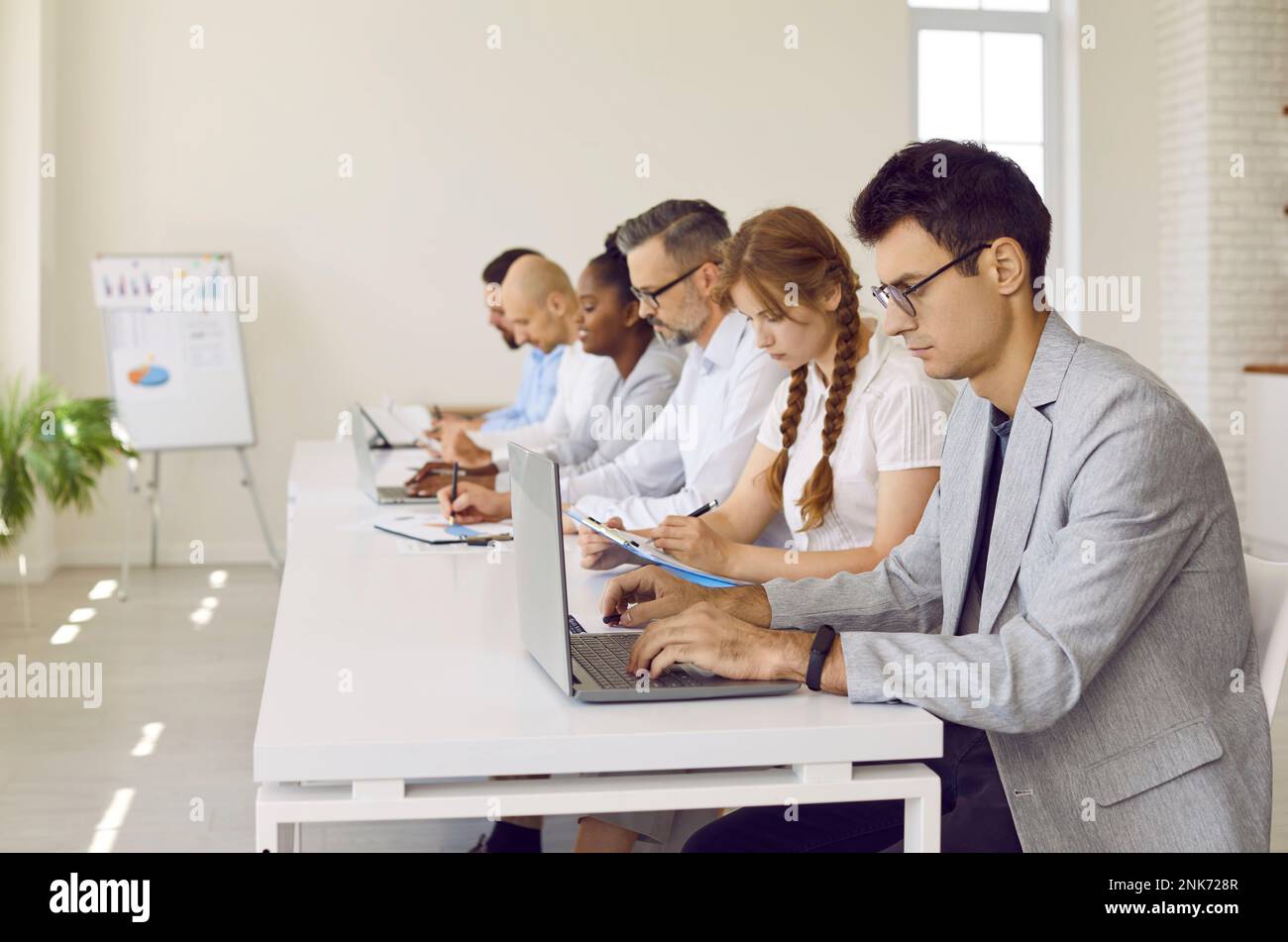 Business group reviewing documents hi-res stock photography and images ...