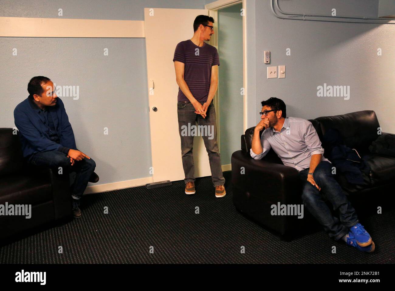 Matt Lieb, center, host and comedian, keeps his eye on backstage before ...