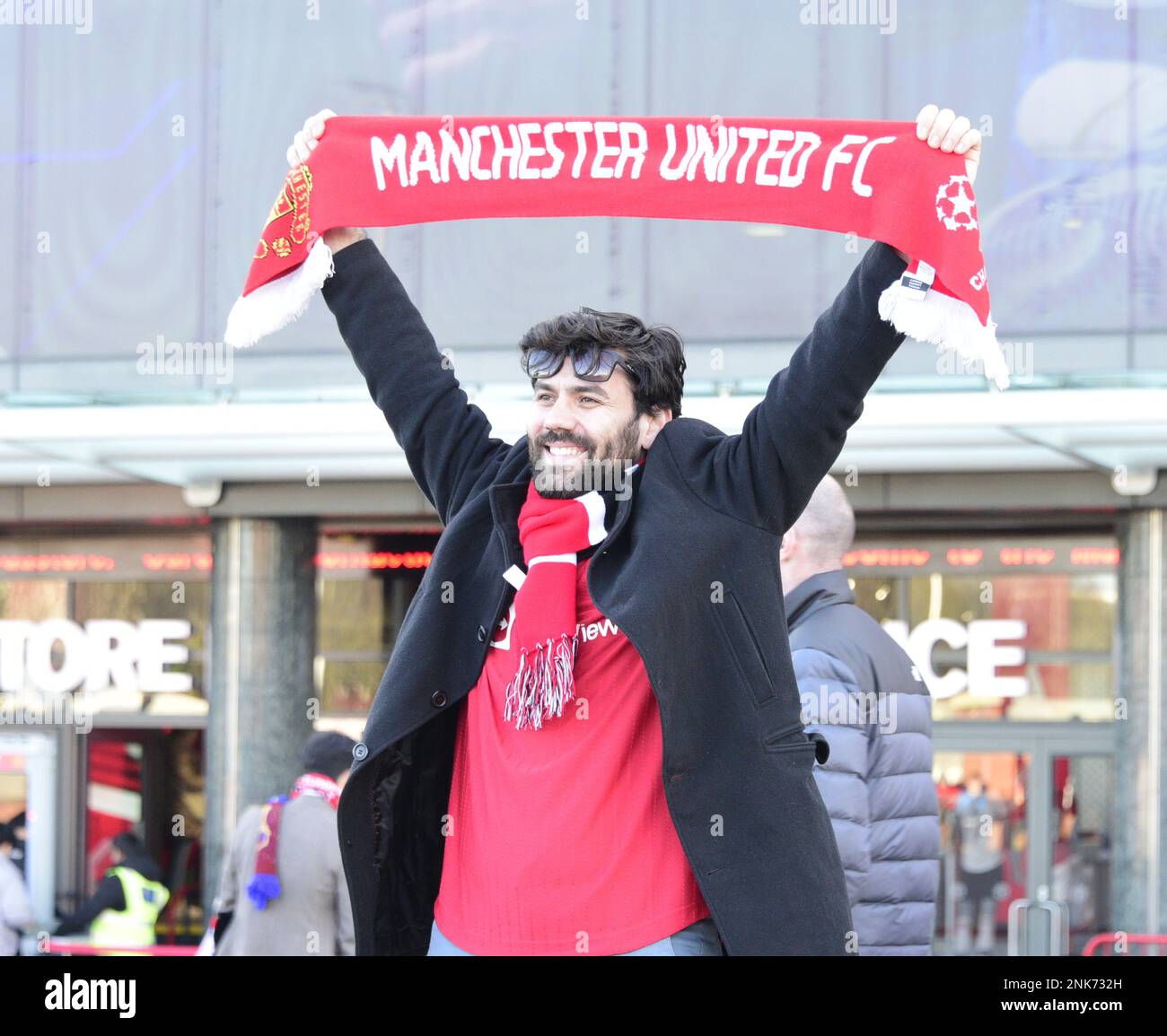 Manchester, UK, 23rd February, 2023. A fan holds a MUFC scarf. The ...