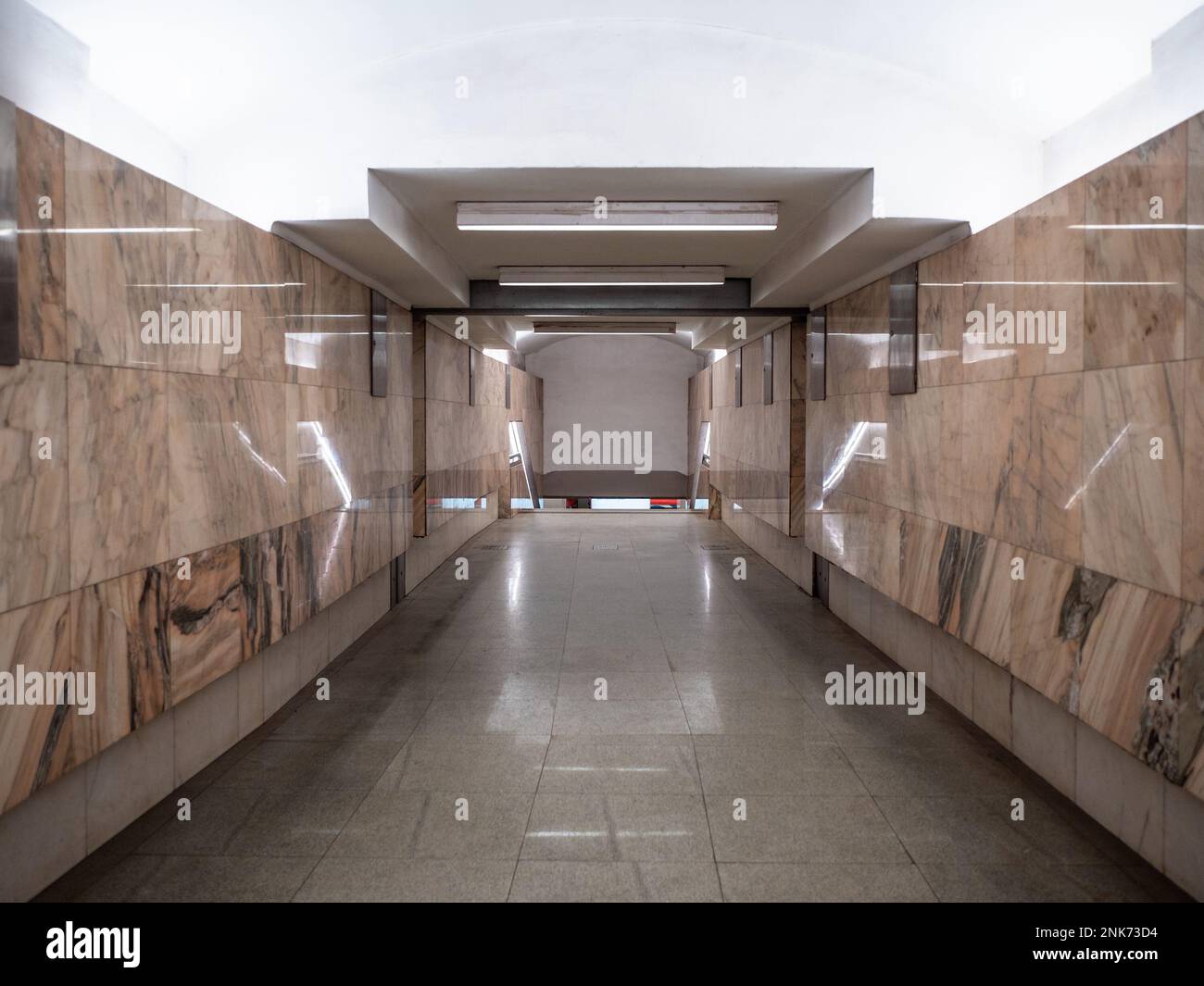 empty underground passege tiled by marble in subway in Moscow city ...