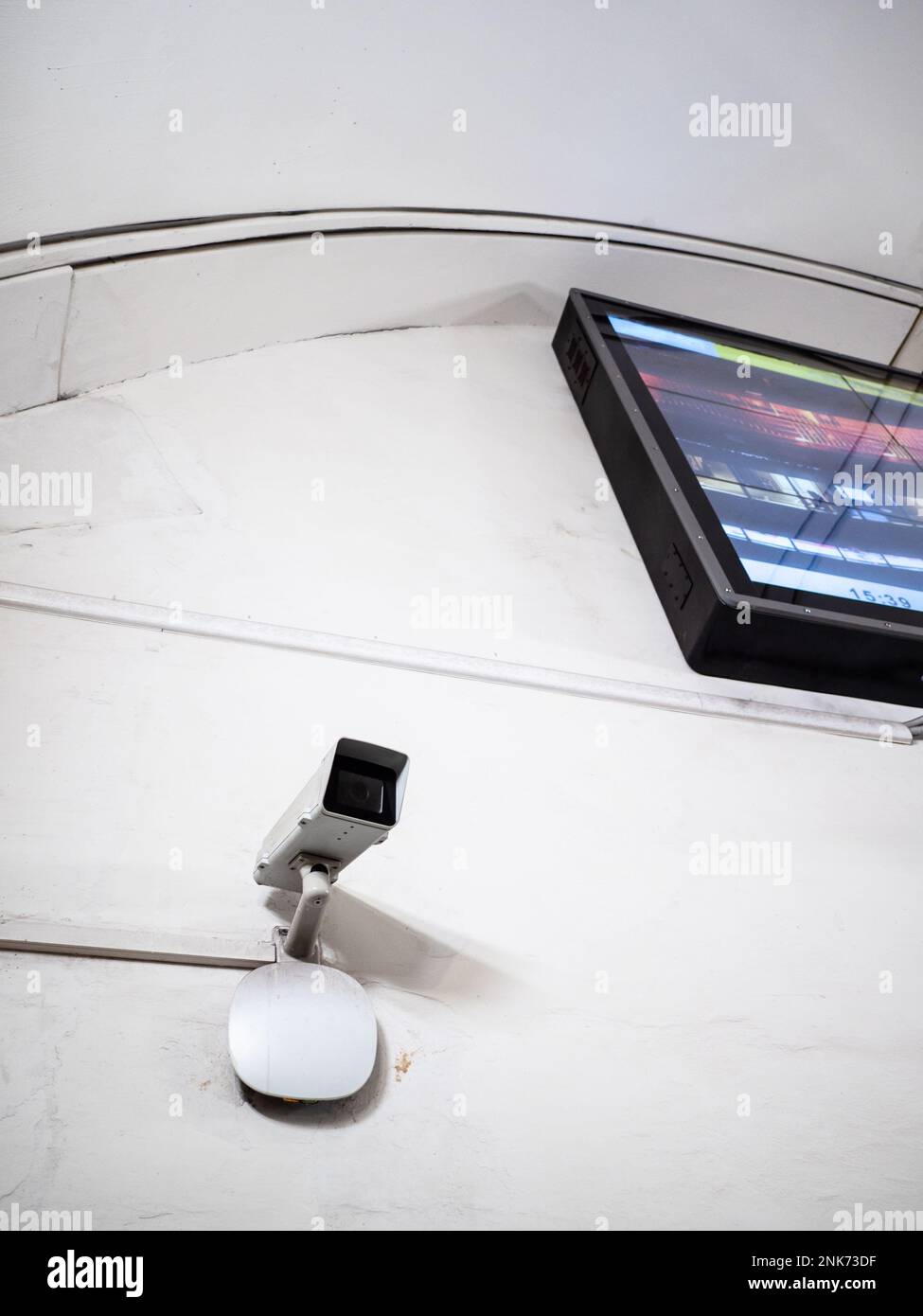 surveillance camera under ceiling in underground passage in subway ...
