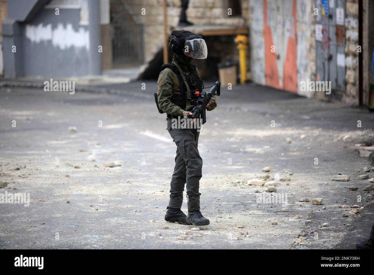 East Jerusalem, Israel. 23rd Feb, 2023. An Israeli border guard with a ...