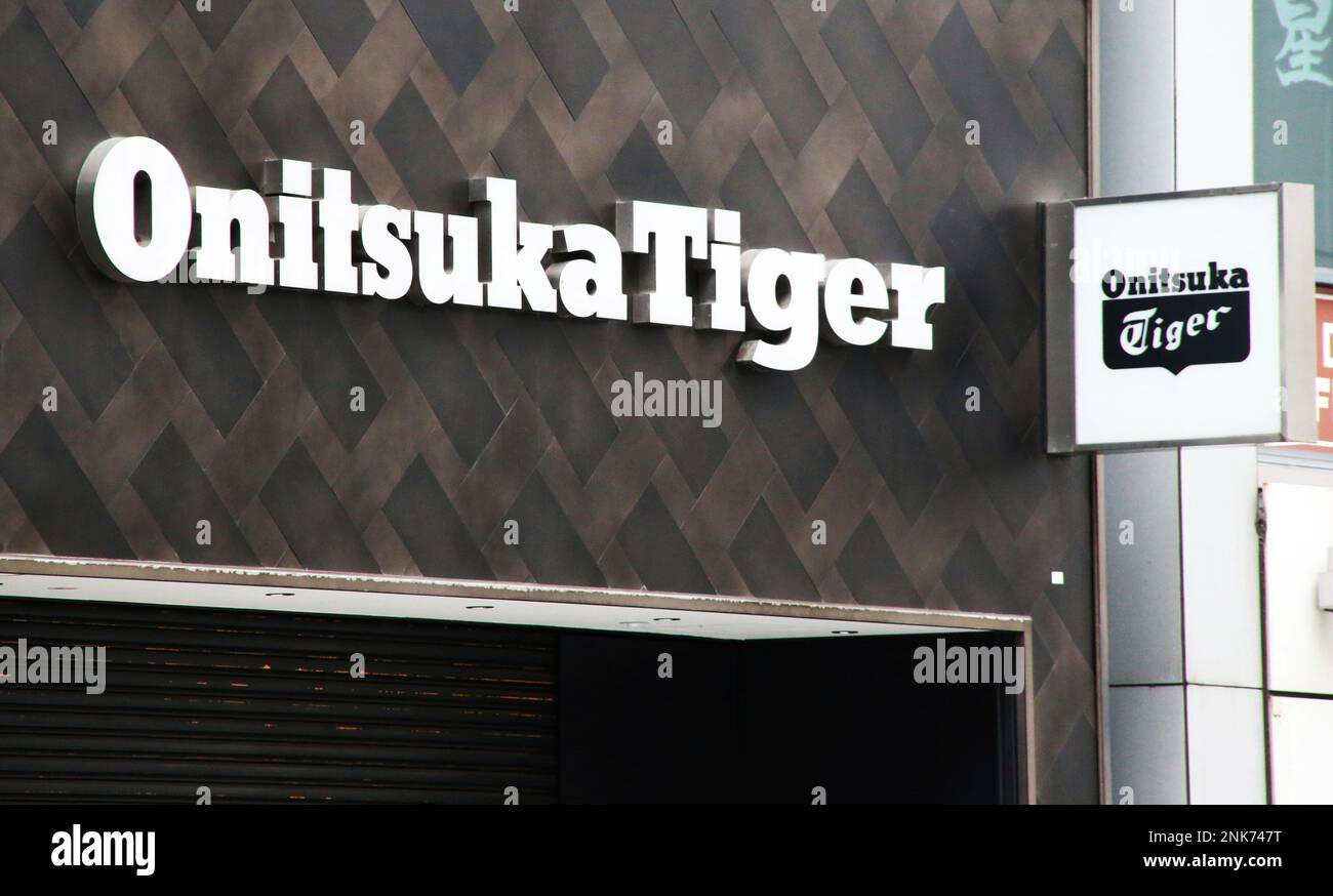 The trademark of Onitsuka Tiger is seen in Shinjuku Ward, Tokyo on ...