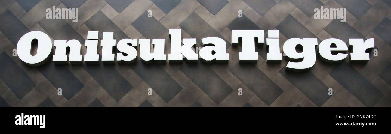 The trademark of Onitsuka Tiger is seen in Shinjuku Ward, Tokyo on ...