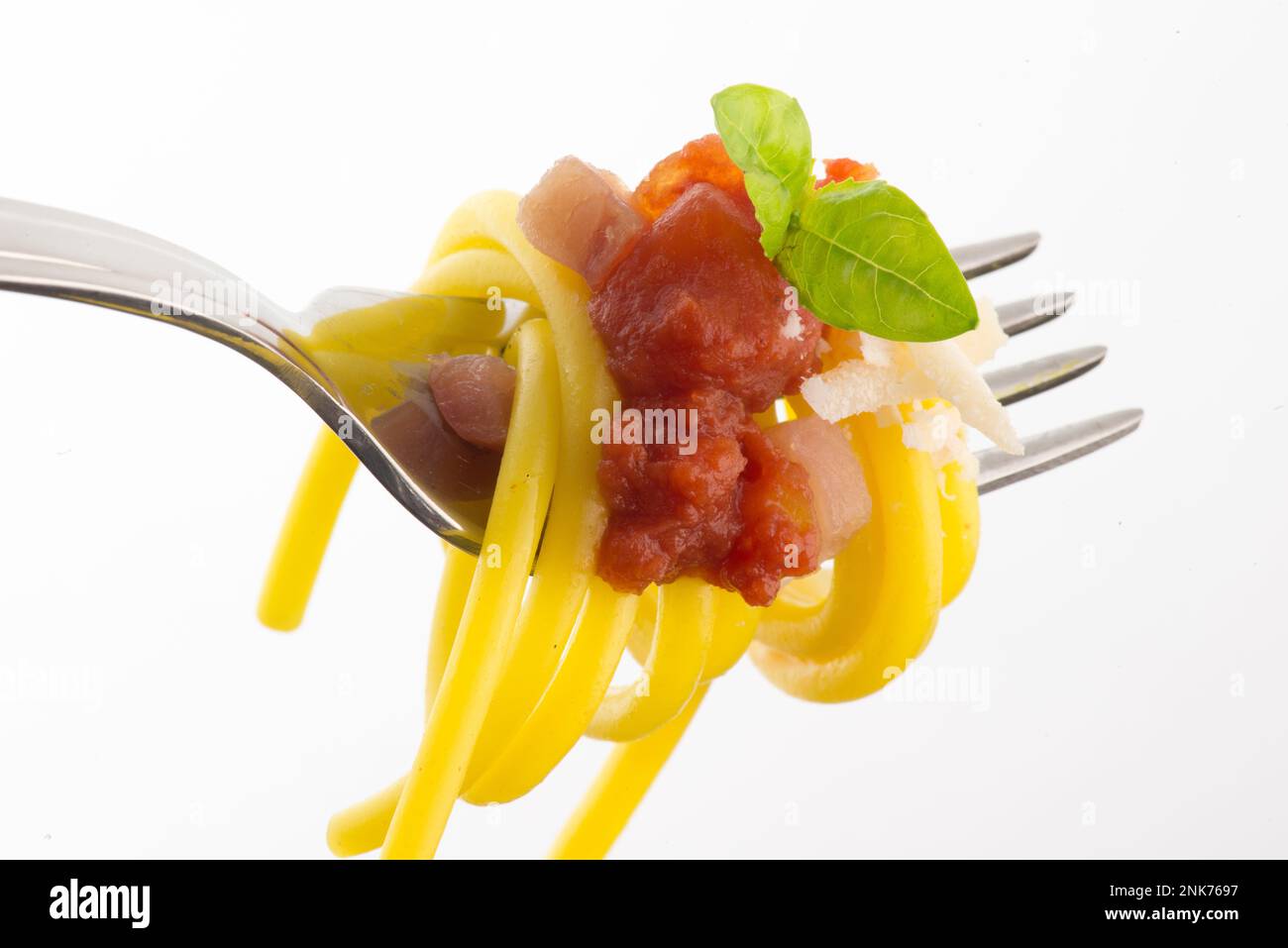 fork with spaghetti and amatriciana sauce isolated on white background ...