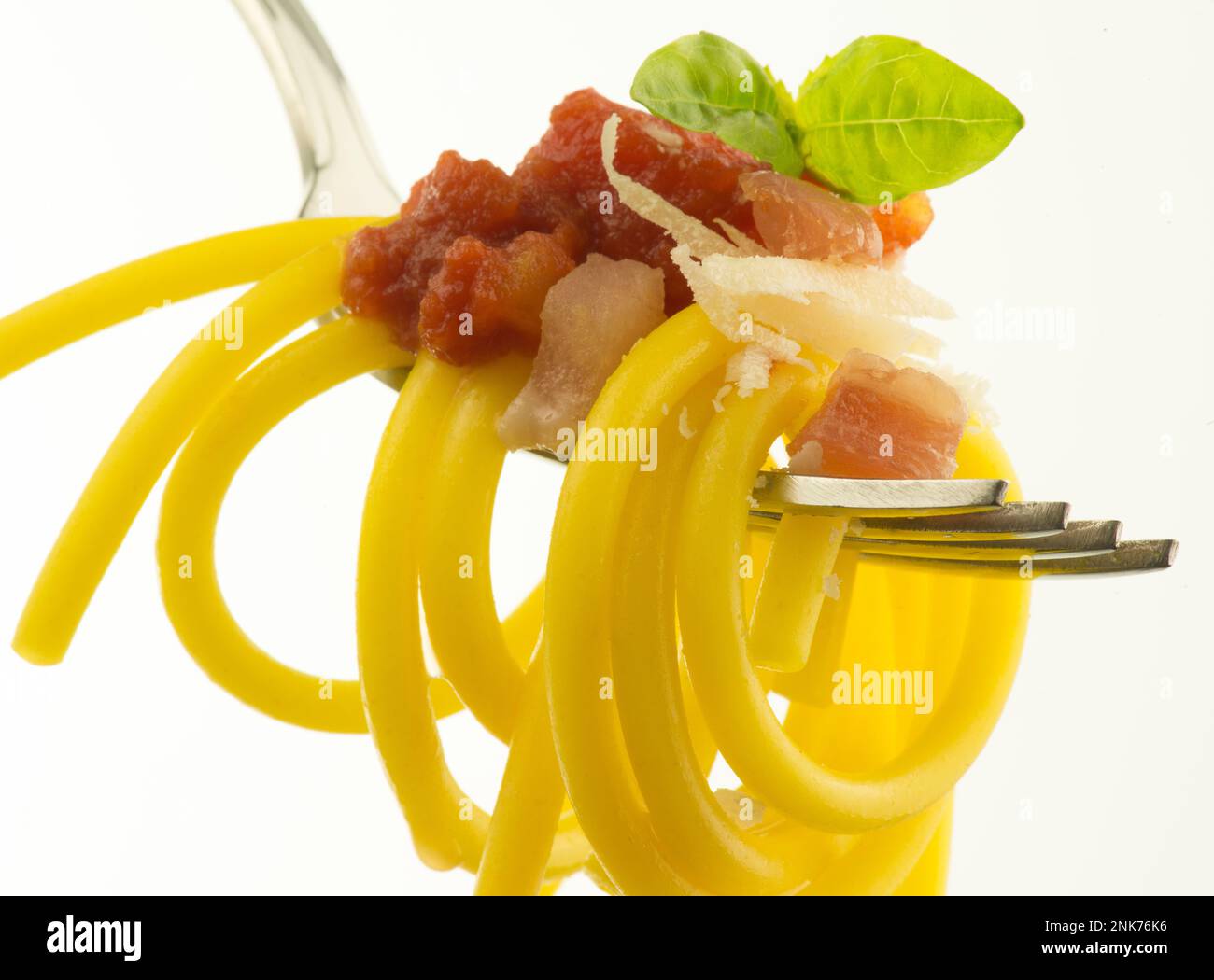 fork with spaghetti and amatriciana sauce isolated on white background ...