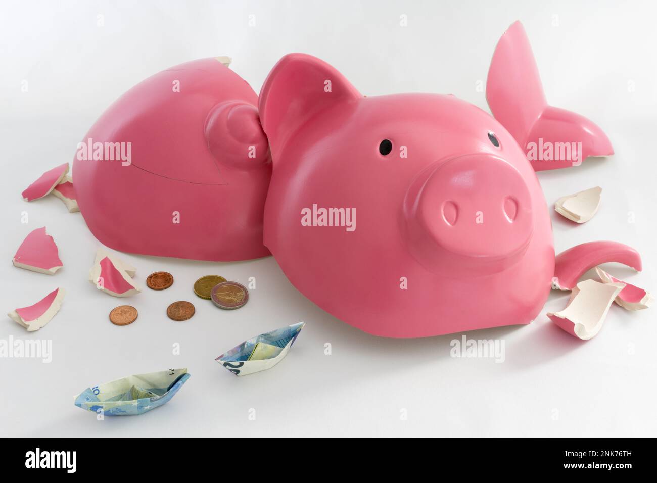 Piggy bank symbol for inflation, economy and crisis. Pink coloured on ...