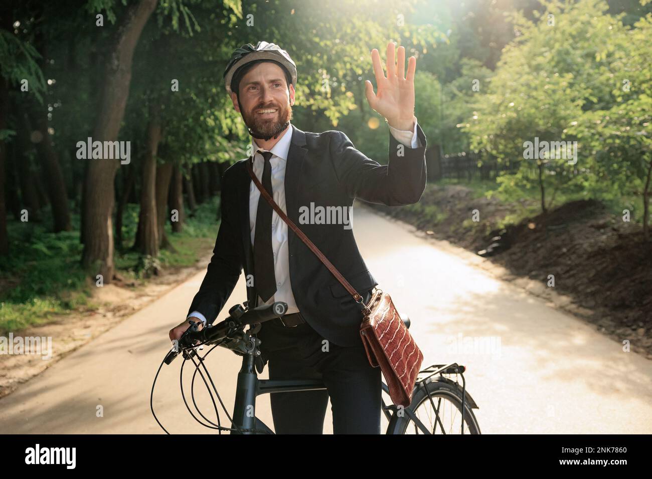 Young male manager greeting business client by hand, while riding on ...