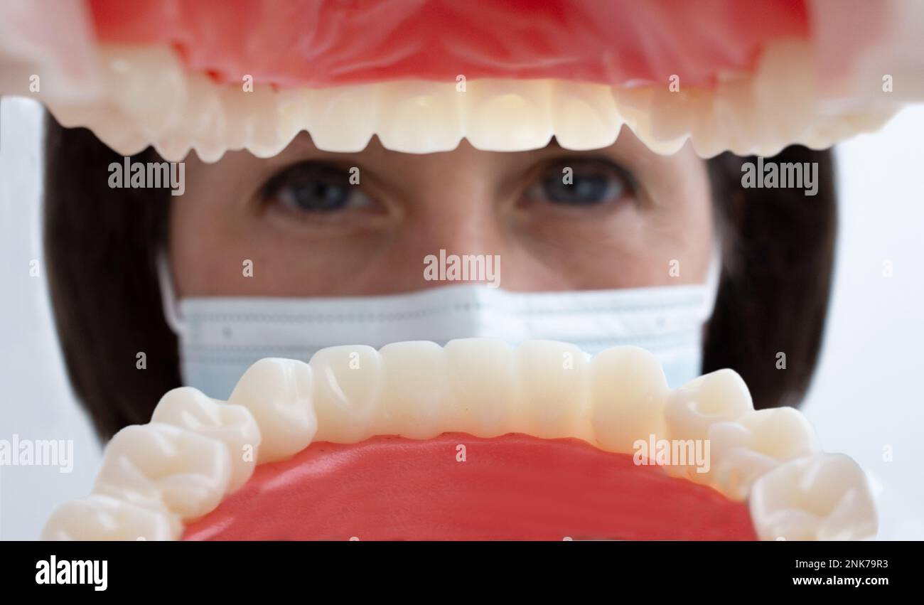 Shot from mouth looking out at female dentist. View from inside the ...
