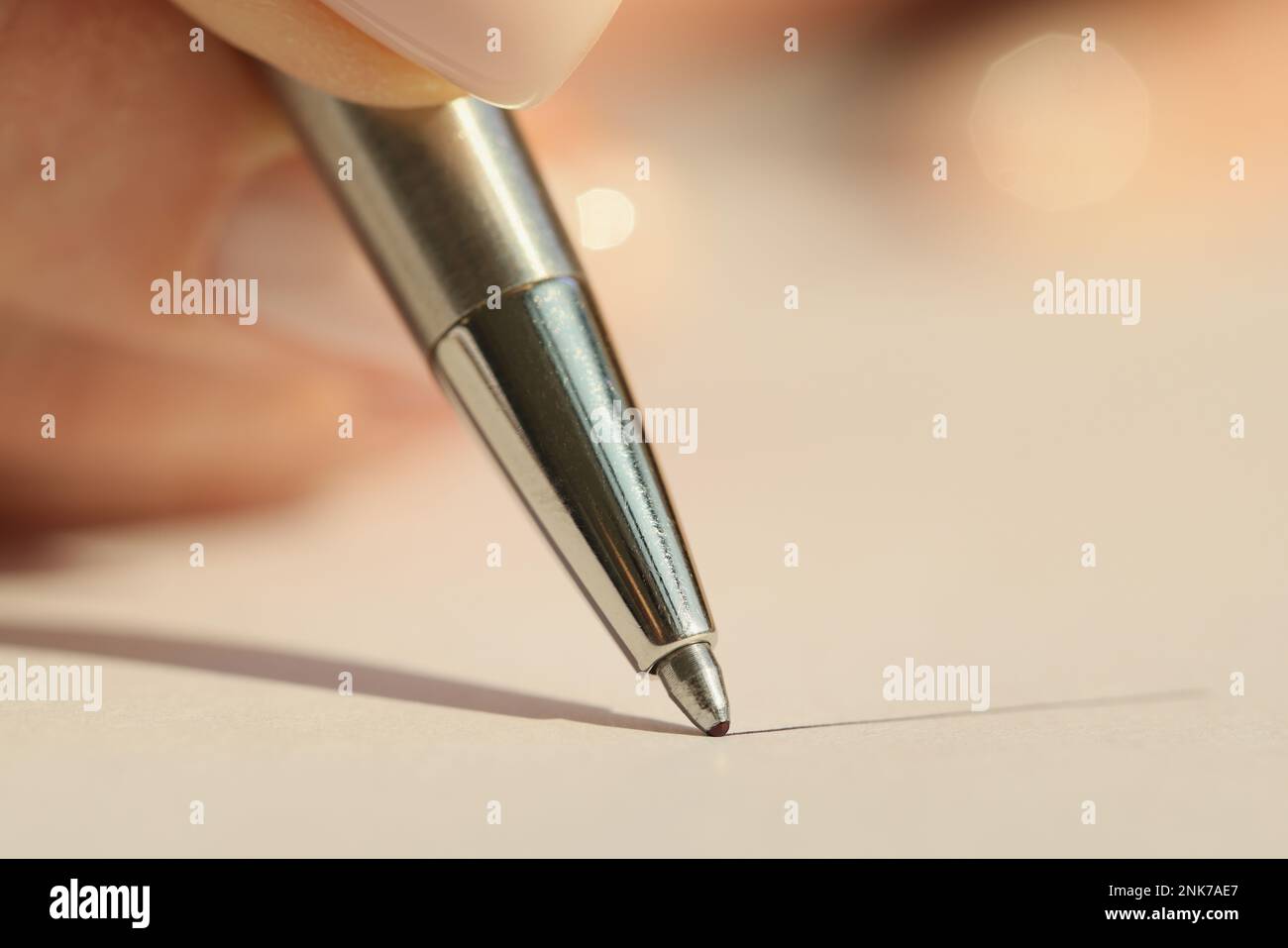 The macro roller of the ballpoint pen draws a line on paper Stock Photo ...