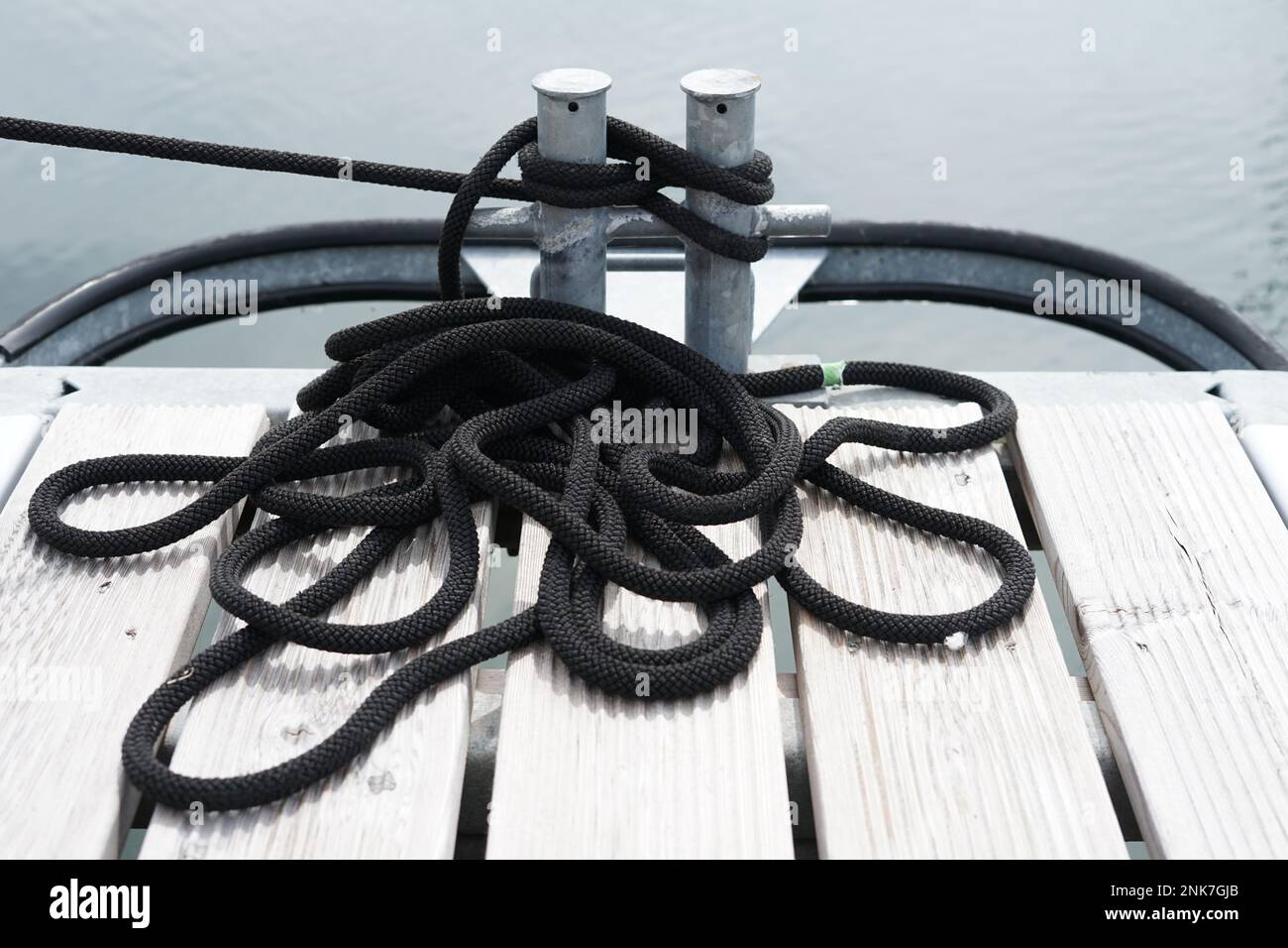Rope on the mooring line in safe harbor Stock Photo - Alamy