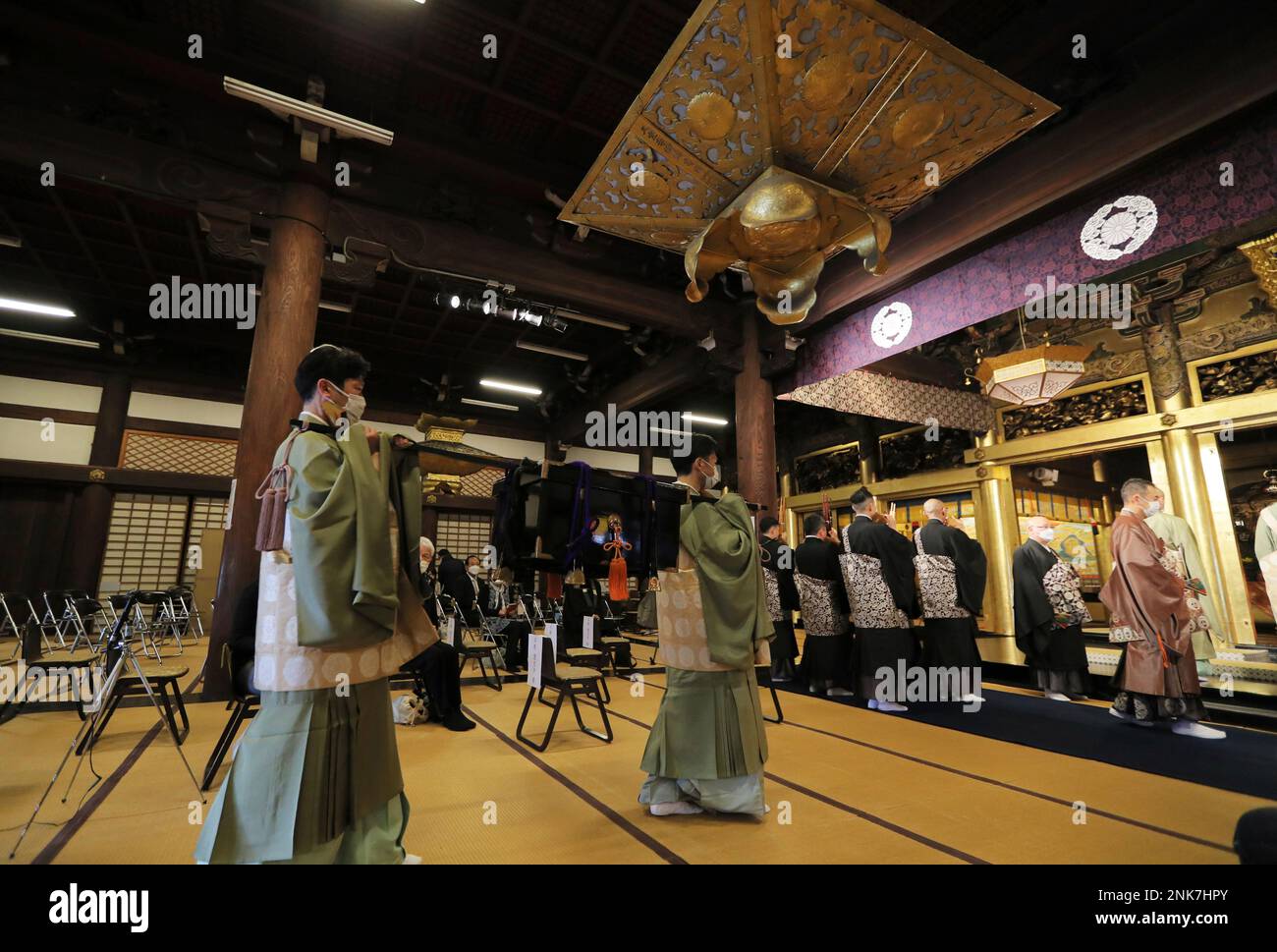 Buddhist monks of the Jodo Shinshu sect carry a karato box containing ...