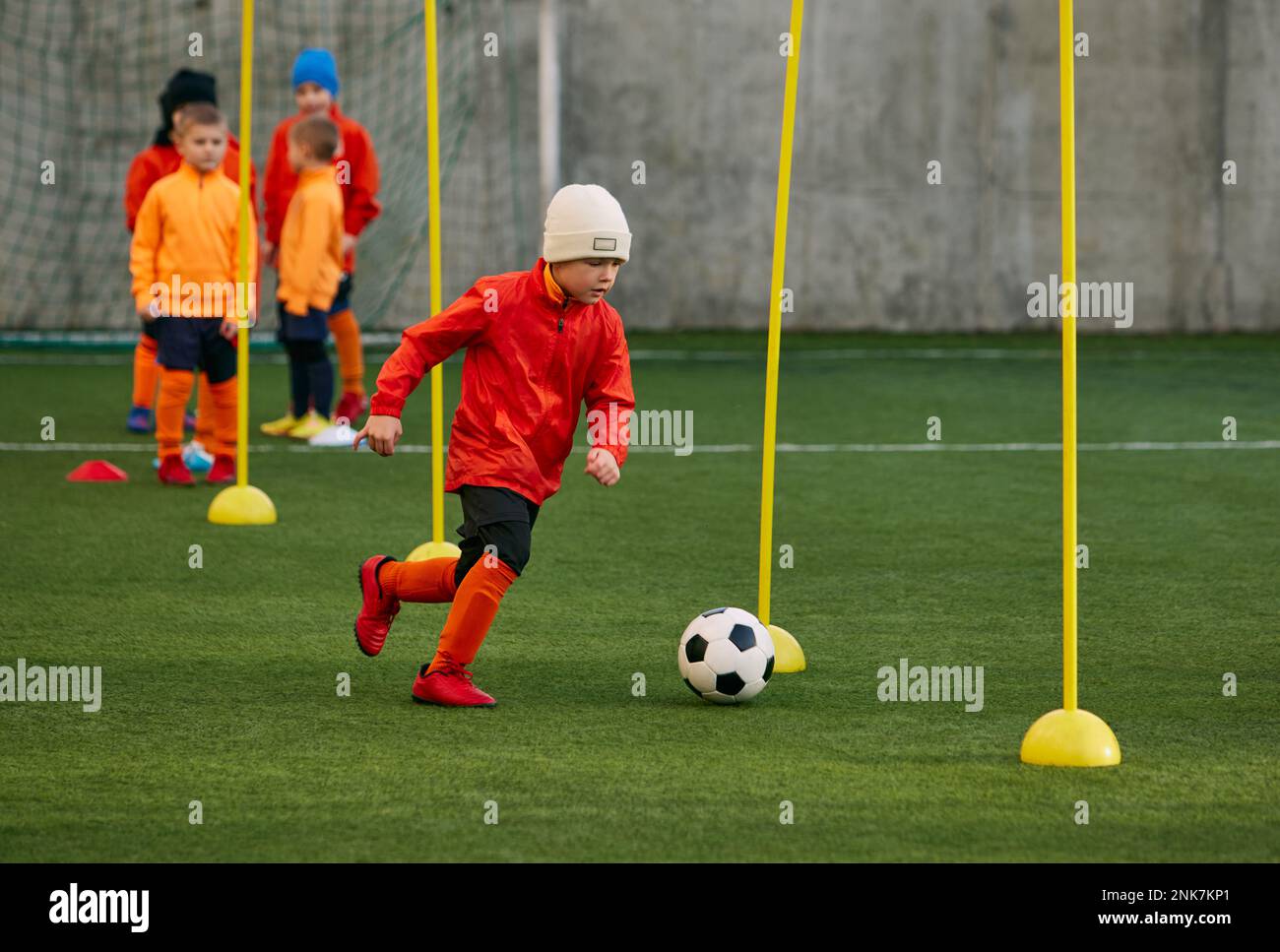 Special exercises with ball. Little boy, child, football player in ...