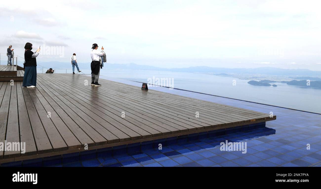Visitors walk on Biwa Terrace at Biwako (Lake Biwa) Valley in Otsu ...