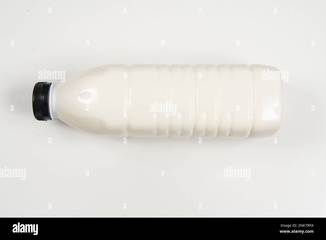 1 liter plastic milk pot on white background Stock Photo - Alamy