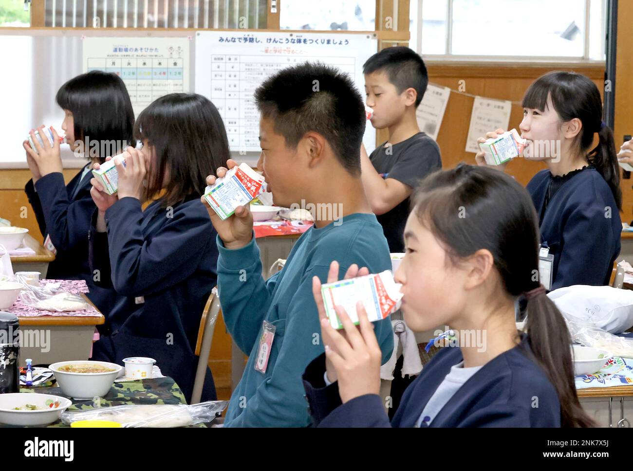 Students drink milk without straws at an elementary school in Anpachi ...