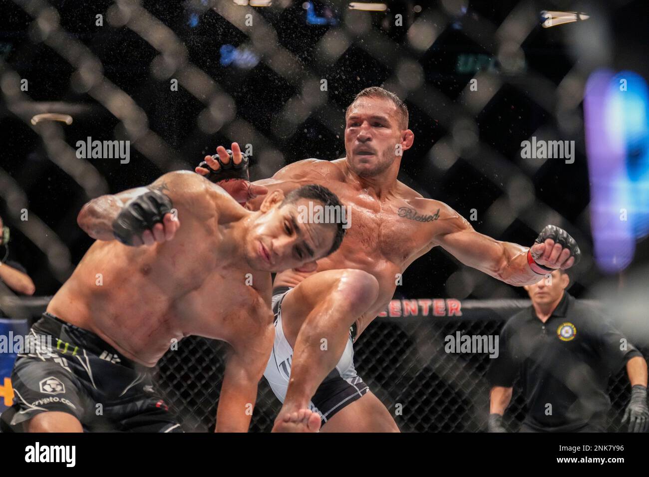 PHOENIX, AZ - MAY 7: (R-L) Michael Chandler knocks out Tony Ferguson ...
