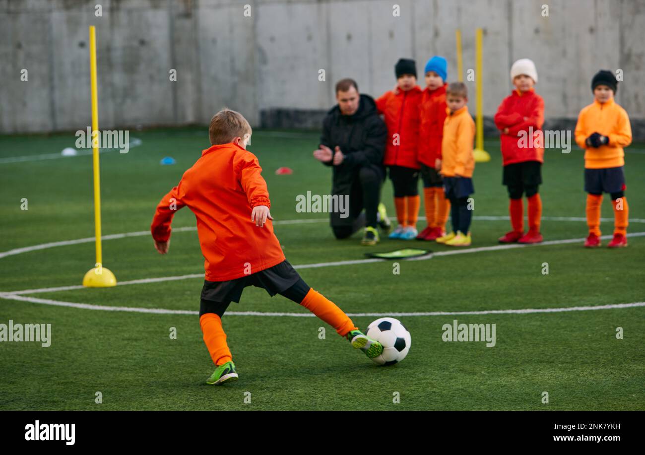 Little boy, child, football player in uniforma training outdoor at ...