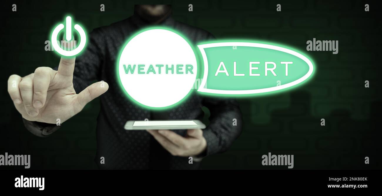 Sign displaying Weather Alert. Word Written on urgent warning on the ...