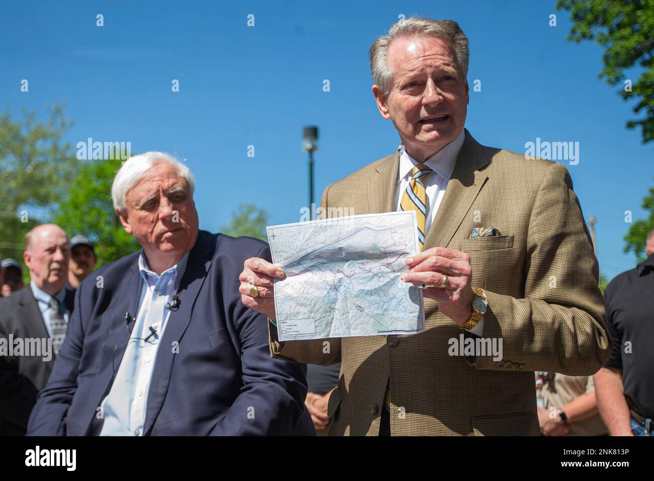 Huntington Mayor Steve Williams, right, holds up a map of the ...