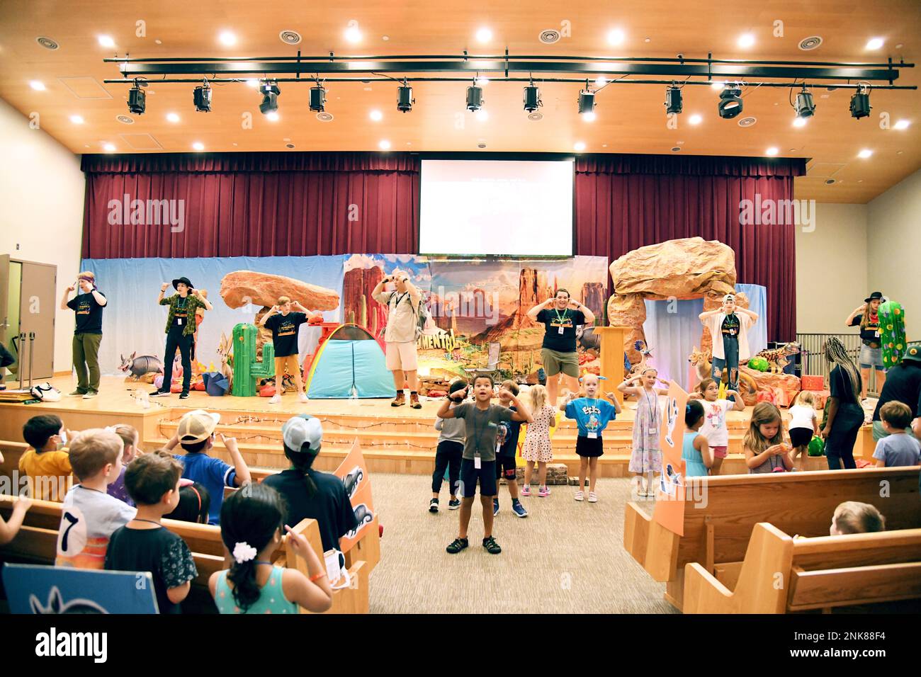 Children join in song and dancing during Vacation Bible School, Aug. 12 ...