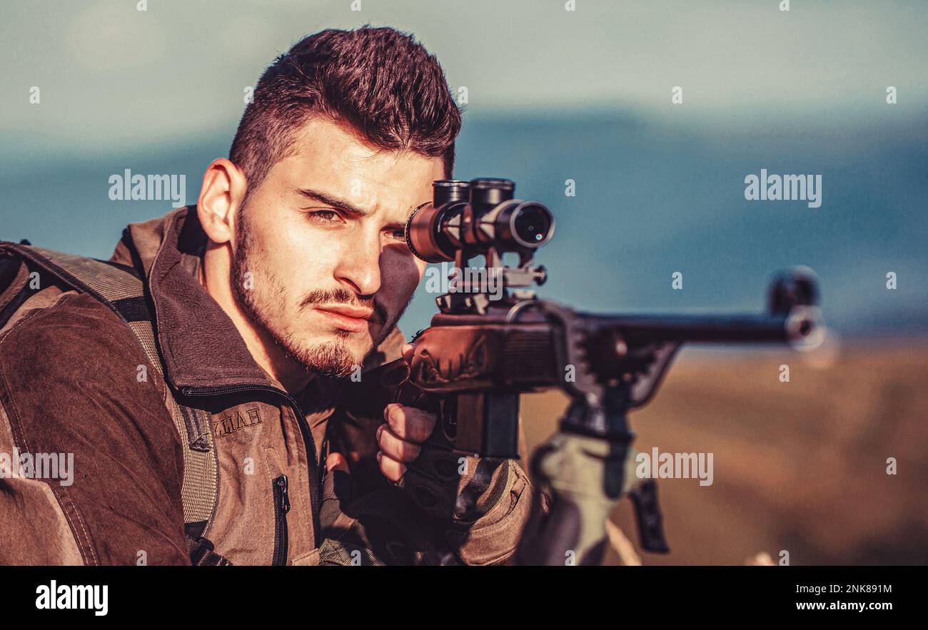 Hunt hunting rifle. Hunter man. Hunting period. Hunter is aiming ...