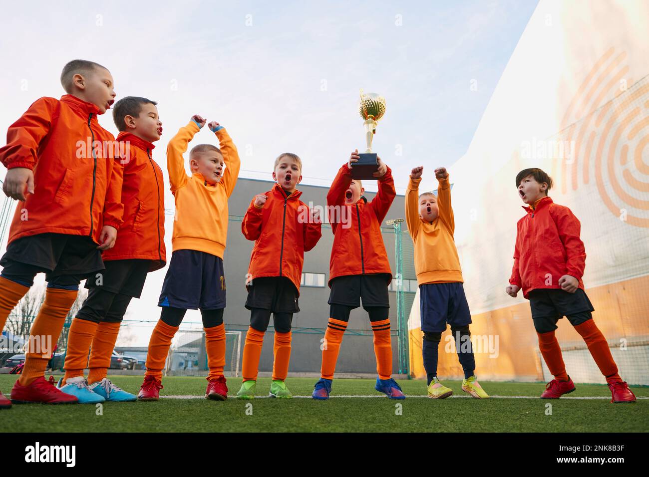 Happiness. Group of little boys, children in uniform, football players ...