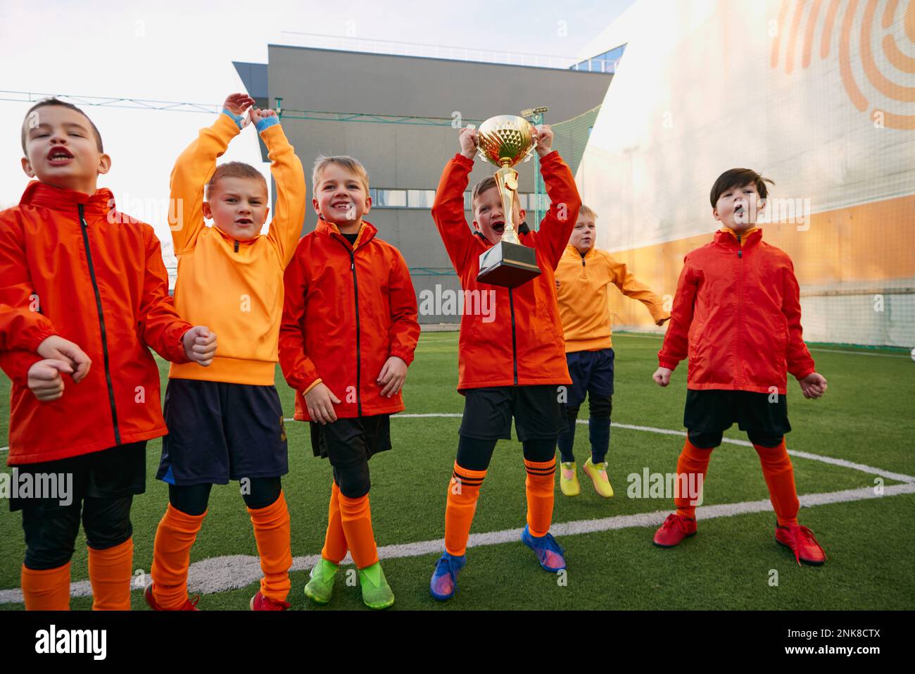Happy champions. Group of little boys, children in uniform, football ...
