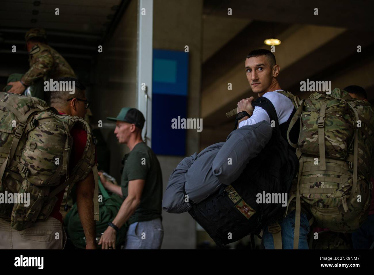 U.S. Army Soldiers from 1916th Support Battalion, 916th Support Brigade load up a truck with the ...