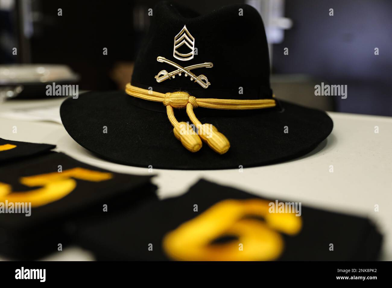 Squad numbers are laid out across a table for competitors in ...