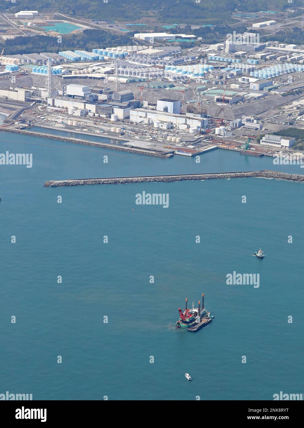An aerial photo shows a drilling vessel off the crippled Fukushima No ...