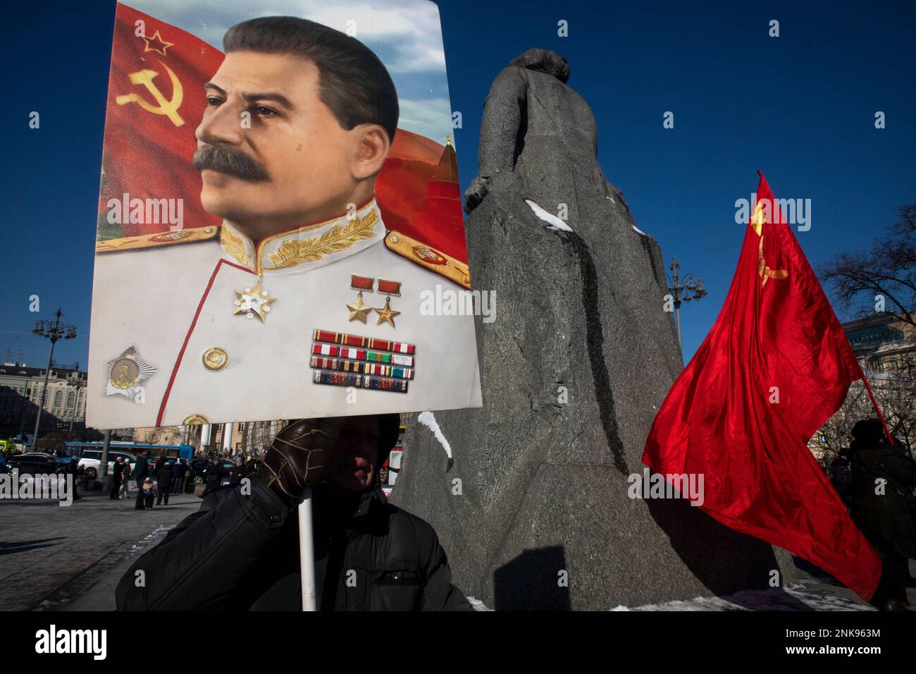Moscow, Russia. 23rd of February, 2023. A man holds a portrait of ...